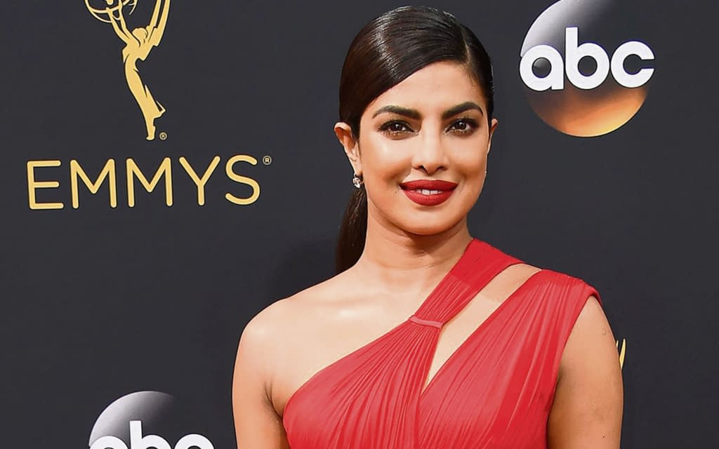 A vision in red: PeeCee rocks the Emmy in crimson...