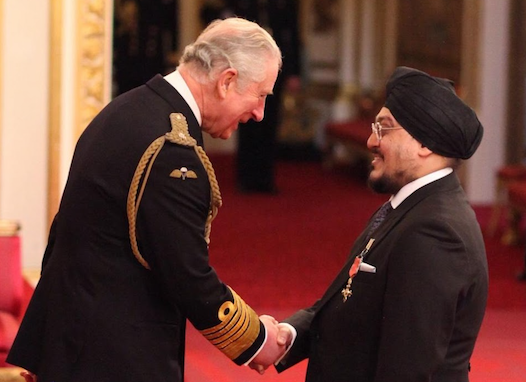 Dr Jason Wouhra receives OBE at Buckingham Palace...